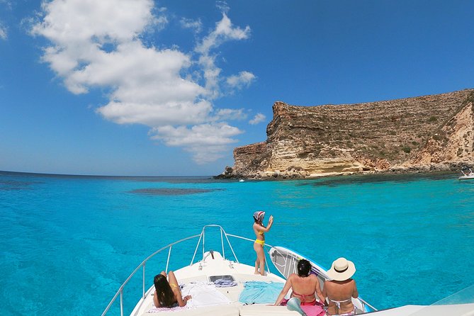 7 hours Boat trip to Lampedusa lunch, SUP and Snorkeling - The Sum Up