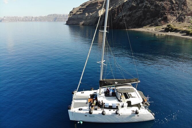 Half-Day Exclusive Catamaran Cruise in Santorini with Meal and Open Bar - What Makes This Tour Truly Stand Out?