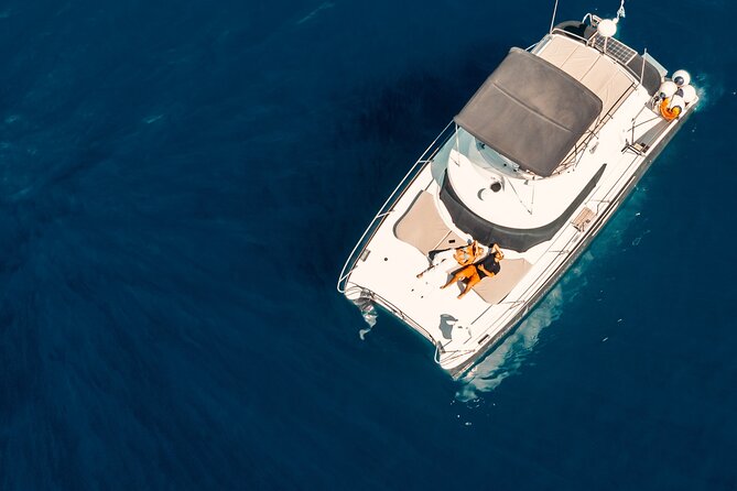 Private Caldera Cruise with Power Catamaran ENJOY incl. Meal & Drinks - Savoring the Santorini Caldera from a Private Power Catamaran