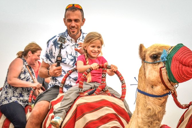 Abu dhabi: morning desert safari with camels and sandboarding what the reviews say about guides and service
