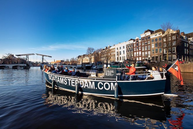 Amsterdam canal cruise with live guide and unlimited drinks from landmarks to hidden corners