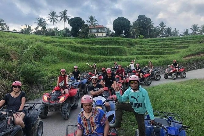 Atv quad bike through tunnel and waterfall in bali authenticity and safety