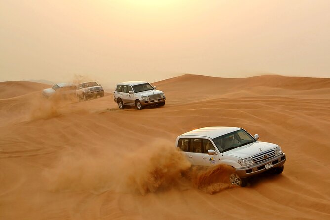 Desert safari experience with dune bashing and dinner in dubai the sunset and arabian camp