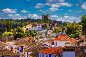 Three cities in one day: porto, nazare and obidos from lisbon price and value