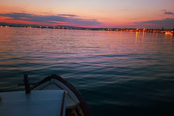 Sunset boat tour with aperitif and swimming break - Key Points