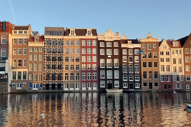 Amsterdam Layover: Walking Tour & Canal Cruise + Airport Transfer - What to Expect at Each Stop:
