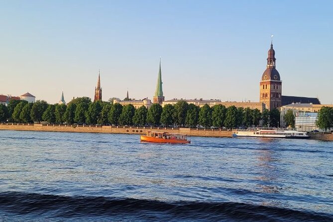 Riga Canal and Daugava Boat Tour with Welcome Drink & Audio Guide - Key Points
