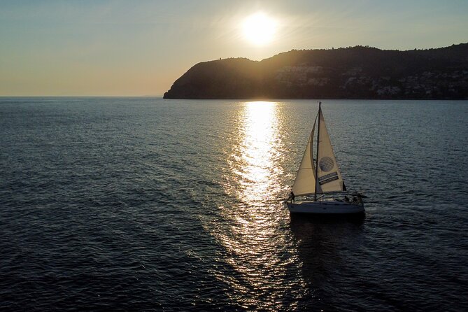 Sunset sailing along the cliffs of Maro- Private - The Boat and Crew