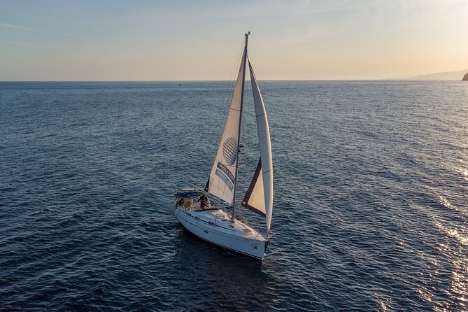 Sailing at sunset along the cliffs of Maro-Compartida - Pricing and Value