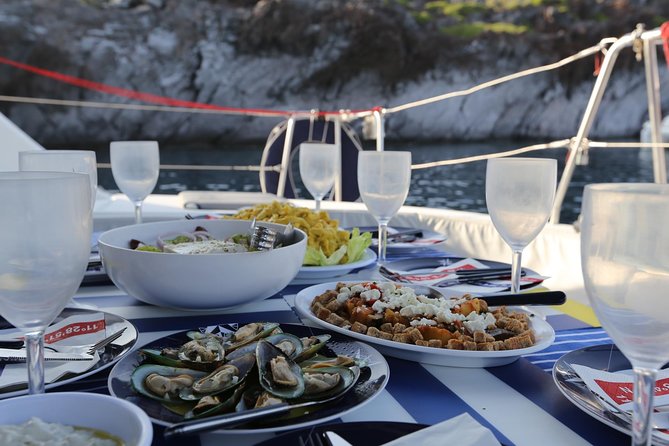 Santorini Half Day Catamaran Private Cruise incl. Meal, Drinks & Free Transport - The Sum Up