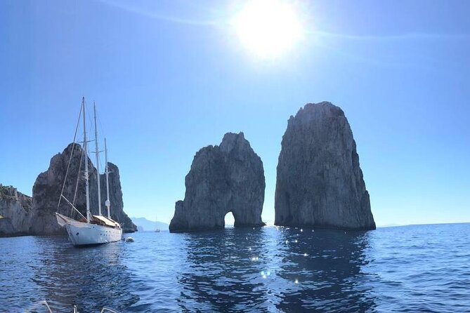 Sunset at Faraglioni rocks - unforgettable overnight stay  Capri - Punta Carena Lighthouse: The Western Tip