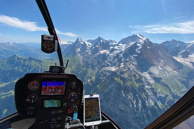 Private Swiss Alps helicopter tour over snow covered mountain peaks and glaciers - The Sum Up