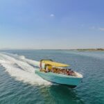 Alcudia: Coll Baix Beach & Sea Caves Cruise with Snorkeling - Embarking on the Boat