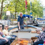 Amsterdam: 75 minute Open Boat Canal Cruise with Live Guide - Discovering the Amsterdam Canals: An Authentic Perspective