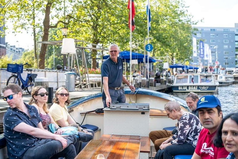 Amsterdam: 75 minute Open Boat Canal Cruise with Live Guide - Discovering the Amsterdam Canals: An Authentic Perspective