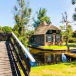 Amsterdam: Giethoorn Tour with Boat Ride & Afsluitdijk Visit - A Deep Dive into the Experience