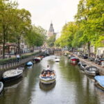 Amsterdam: Open Boat Tour of Canals with Expert Local Guide - Detailed Breakdown of the Tour Itinerary
