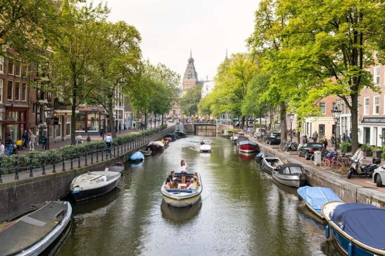 Amsterdam: Open Boat Tour of Canals with Expert Local Guide - Detailed Breakdown of the Tour Itinerary
