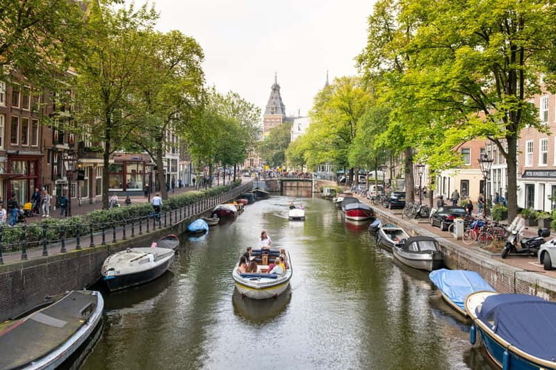 Amsterdam: Open Boat Tour of Canals with Expert Local Guide - Detailed Breakdown of the Tour Itinerary
