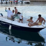 Aperitif on a boat at sunset at the Queen Cave - The Itinerary: What You Can Expect from Start to Finish