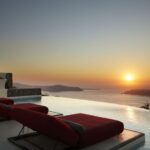 Daybed Relaxation with infinity pool use with caldera views - The Setting and Location