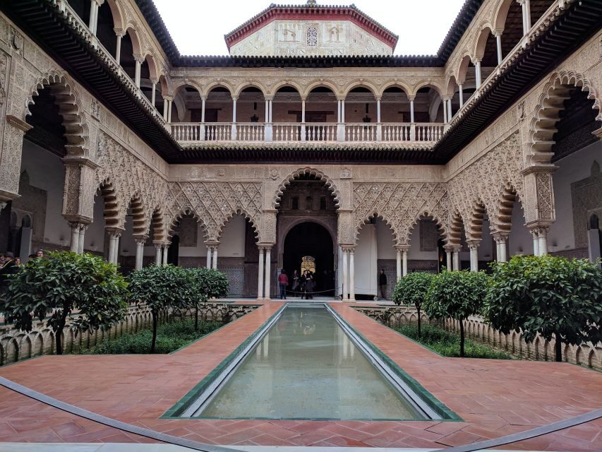 From Malaga: Seville Private Tour with Alcazar and Cathedral - Visiting the Royal Alcazar — A Moorish Masterpiece