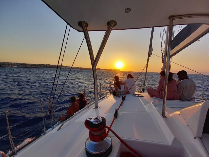 From Rhodes: Private Catamaran Sunset Cruise All Inclusive - What to Expect: Comfort, Cuisine, and Spectacle