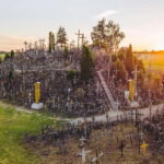 From Riga: Hill of Crosses & Enchanting Jelgava Group Tour - Crossing Borders and Stopping for Photos