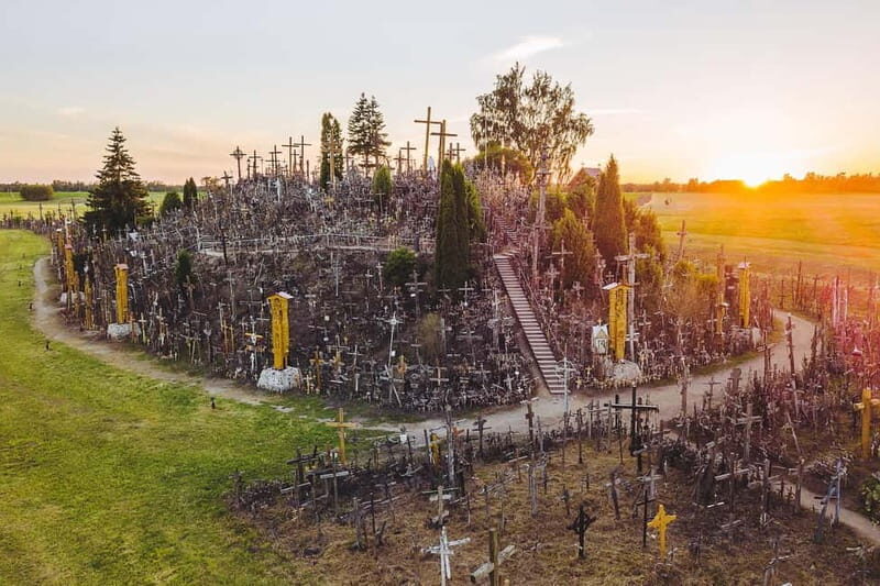 From Riga: Hill of Crosses & Enchanting Jelgava Group Tour - Crossing Borders and Stopping for Photos