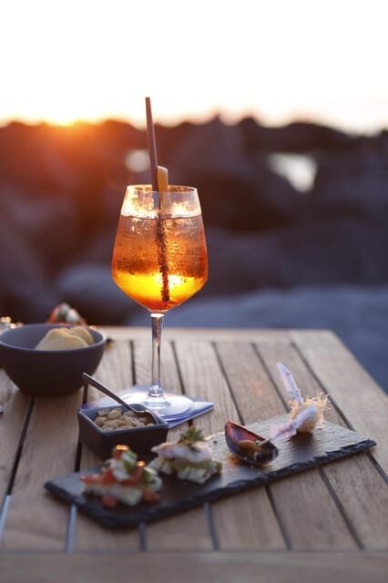 Italian aperitif at the sunset by the sea - An Elegant Aperitif on the Island of Ischia