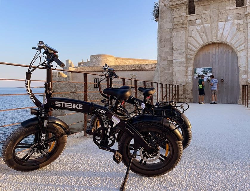 Ortigia E-bike tour and aperitif at sunset - The Sum Up