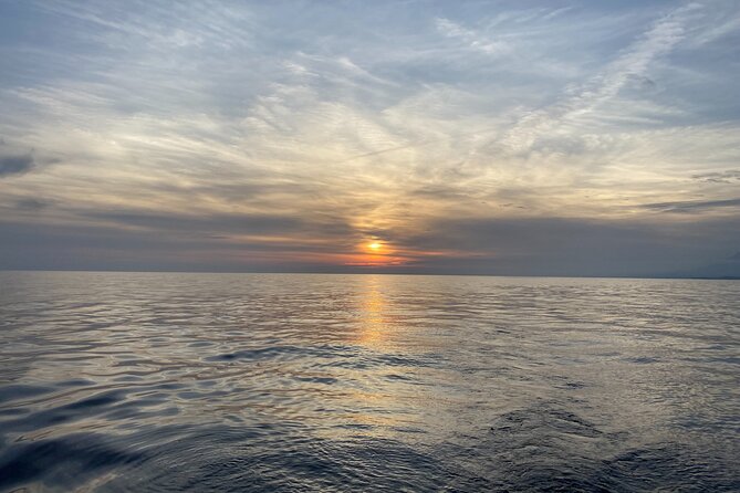 Sailing at sunset along the cliffs of Maro-Compartida - Introduction