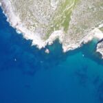 Sesimbra: Boat Trip to the wild beaches and caves - The Sum Up