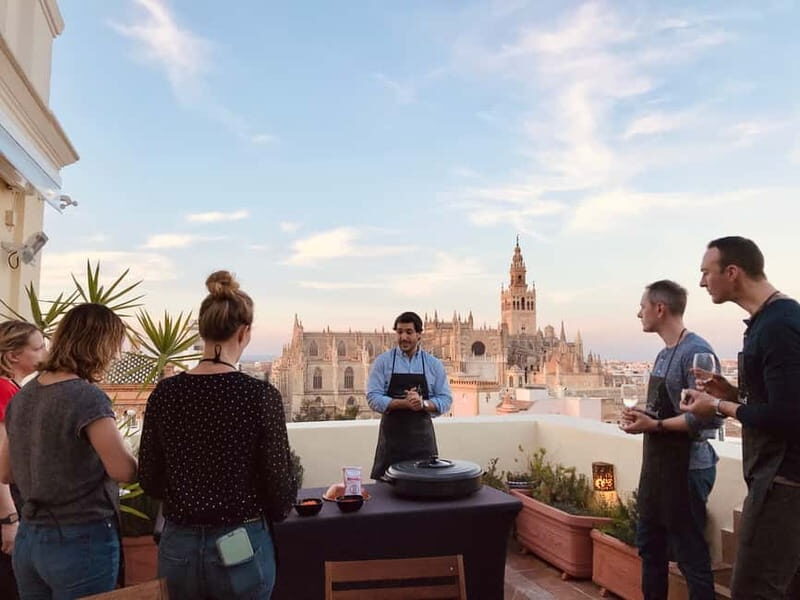 Seville: Private Paella Cooking Class with Cathedral Views - The Scenic Rooftop and the Cooking Experience