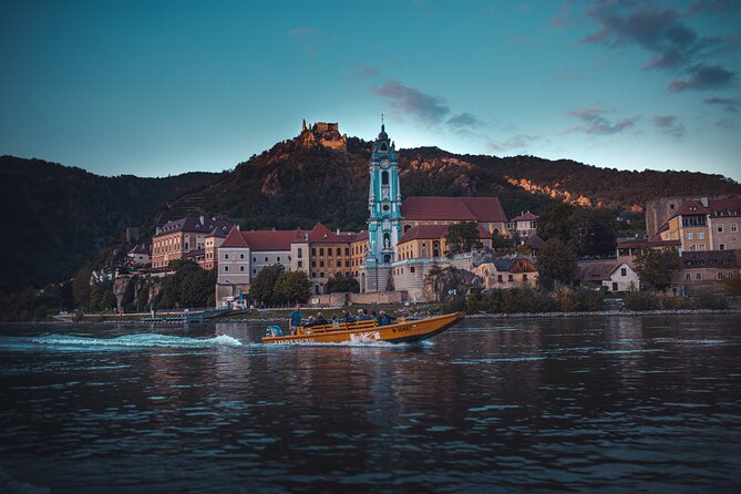 Wine tasting on traditional wooden boats in Wachau Valley - Key Points