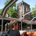 Amsterdam 1h Canal Cruise by Semi-Open Boat with Audio Guide - What to Expect on This Canal Cruise