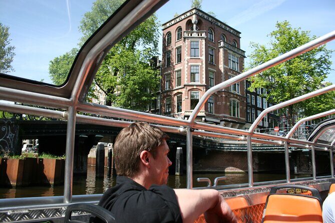 Amsterdam 1h Canal Cruise by Semi-Open Boat with Audio Guide - What to Expect on This Canal Cruise