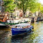 Amsterdam: German-speaking boat trip with bar on board - Key Points