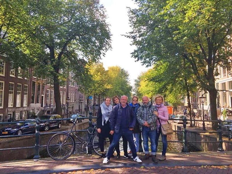 Amsterdam: Jordaan Area Walking Tour - Navigating the Torensluis Bridge and the Smallest House