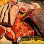 Street Food Tour With a Local Guide in Dallas - The Iconic Landmarks: The Bomb Factory & Main Street Emporium