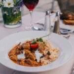 Budapest: Evening Cruise and Dinner with Welcome Drink - The Dining Experience: A Four-Course Hungarian Feast