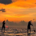 Sunrise Stand Up Paddle activity on a privileged beach. - Key Points