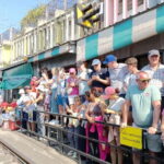 Bangkok: Iconic Floating Markets and Train Market Tour - Floating Along Damnoen Saduak’s Canals