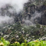 Kunming: Jiaozi (Sedan Chair) Snow Mountain Hiking Day Trip - Exploring the Waterfalls and Rock Formations