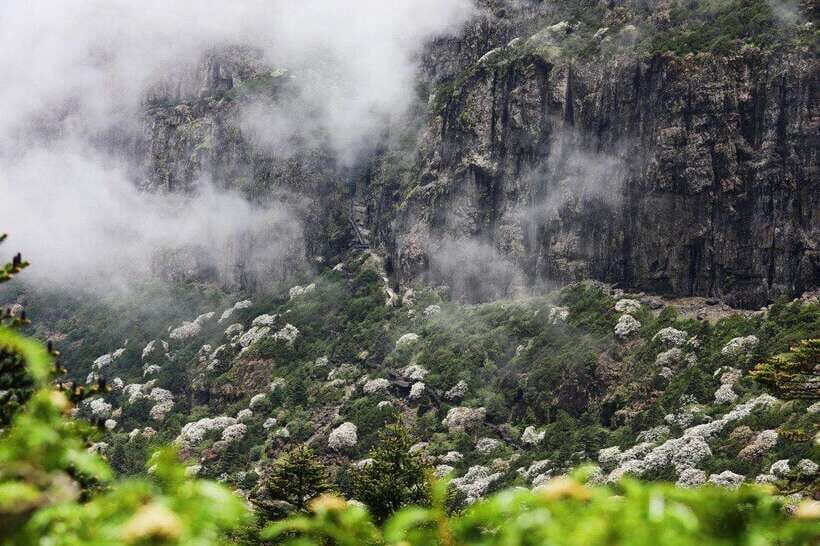 Kunming: Jiaozi (Sedan Chair) Snow Mountain Hiking Day Trip - Exploring the Waterfalls and Rock Formations