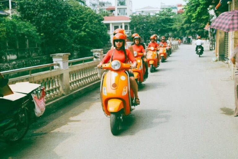 Red River delta & rural village with female Ao dai riders