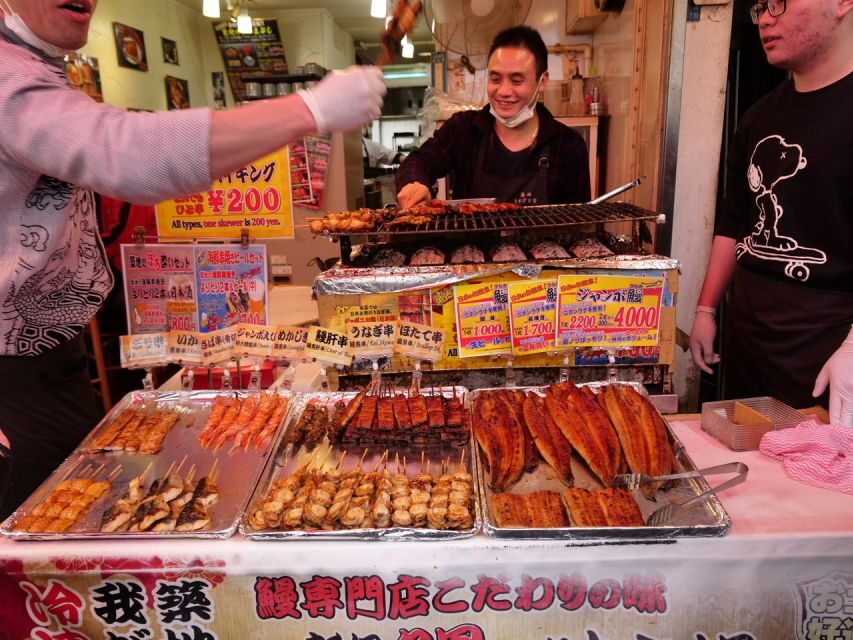 Tokyo: Tsukiji Fish Market Tour (14 Stops, Seafood Lunch) - Cultural Moment at the Buddhist Temple