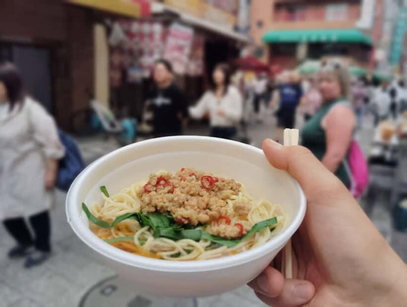 Kobe: 1.5-Hour Local Street Food Guided Tour at Nankinmachi - The Atmosphere and Group Dynamics