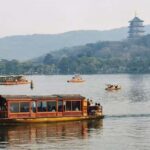 A classic half-day cruise on West Lake - Scenic Stops and Photo Opportunities