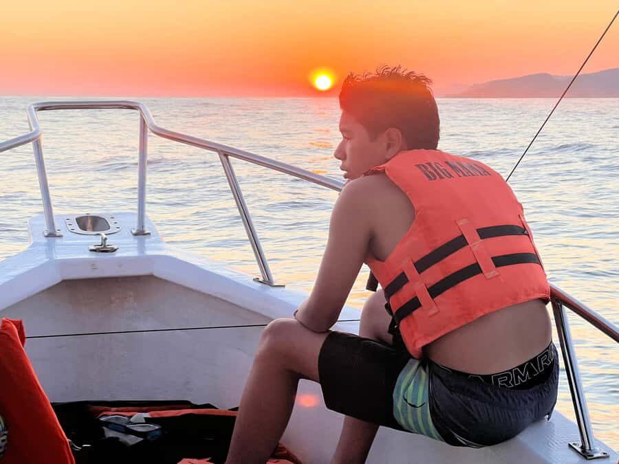 Huatulco: Sunset on a boat in the ocean - The Itinerary: A Closer Look